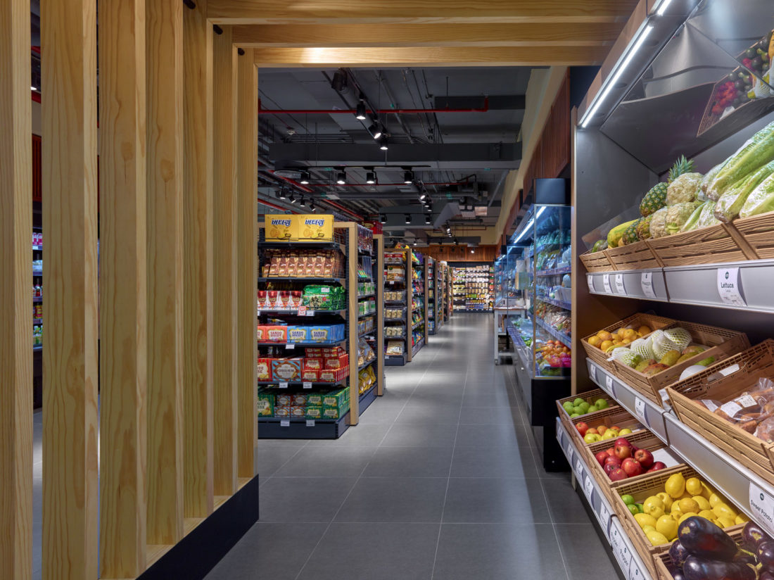 Studio Em uses structural arches creating different zones for a grocery ...