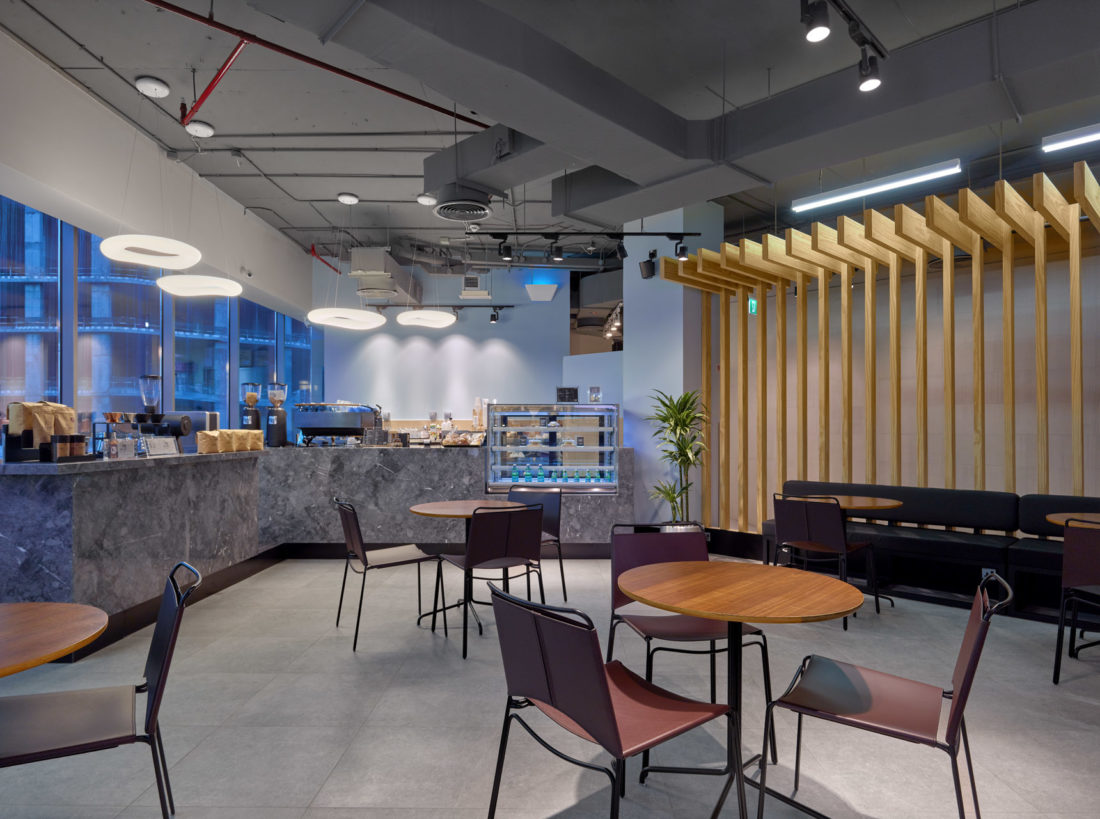 Studio Em uses structural arches creating different zones for a grocery ...